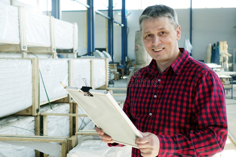 Man with Folder Management in the Hands of the Warehouse . Logistics ...