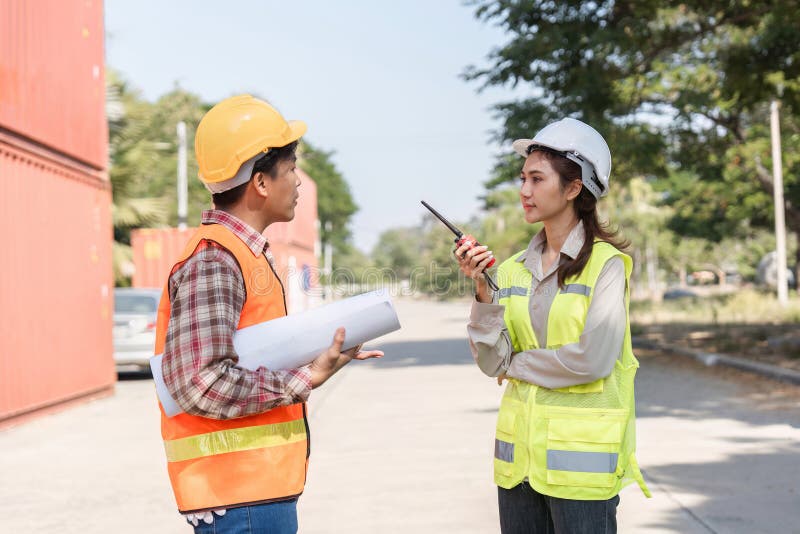 Logistics Engineering Team Engaging in Detailed Discussions Over ...