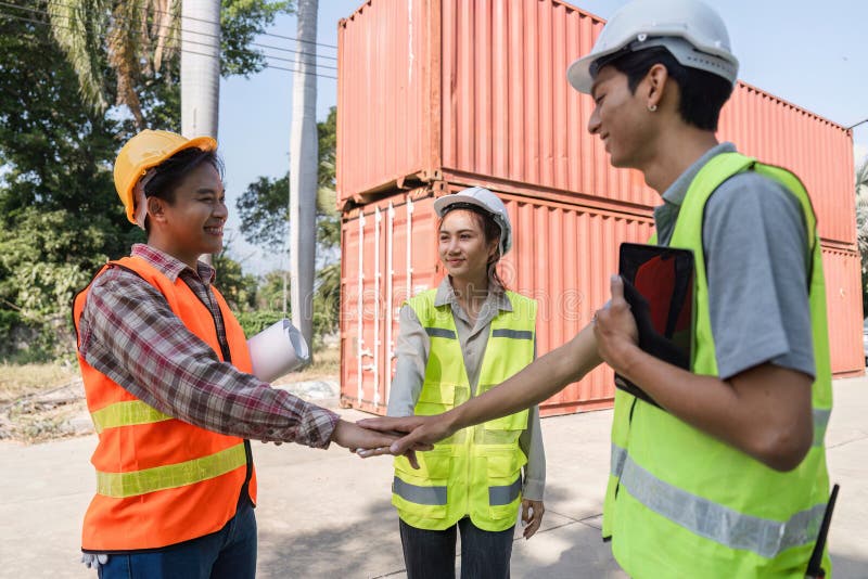 Logistics Engineering Team Sealing Agreements with a Handshake at a ...