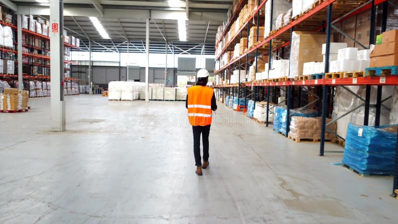 Logistics Operator Walking through Warehouse Stock Video - Video of ...