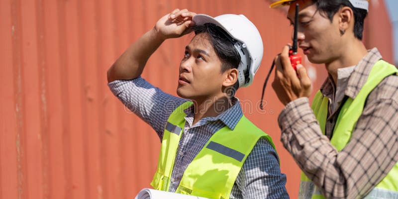 Logistics Planning. Young Engineers Assessing Project Details in a Work ...