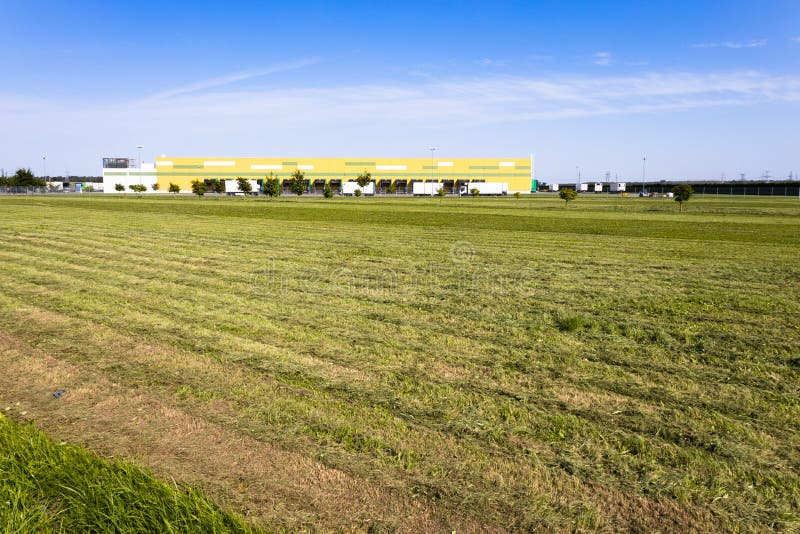 Logistics Warehouse Center, Loading Hub, and Trucks with Cargo Trailers ...