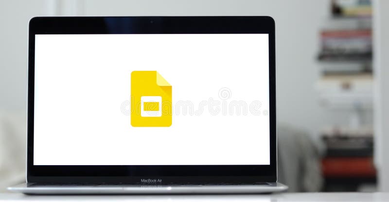 Logo Design of Google Slides on a Laptop Screen in Blurred Background ...