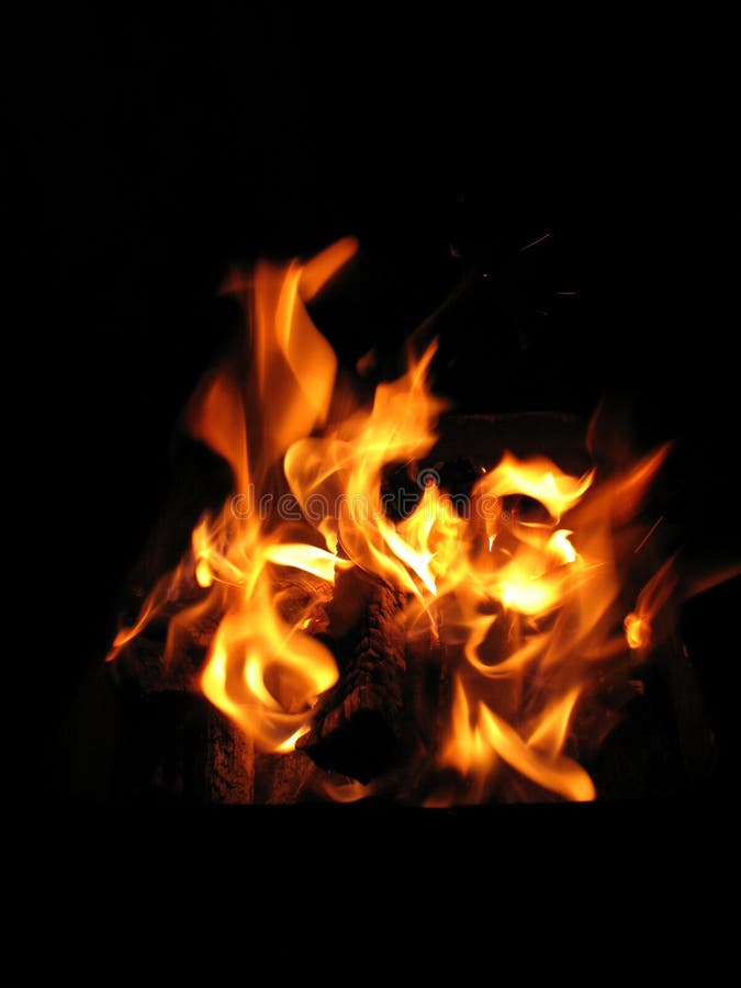 Logs in the fire on black stock image. Image of material - 53404389