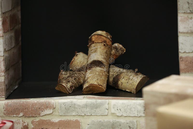 Logs in a fire place stock photo. Image of holidays - 262134550