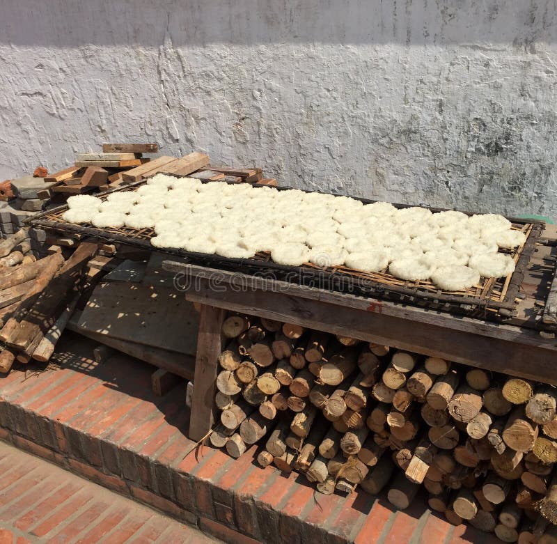 Logs, Dried Rice on the Bamboo Grating beside the Wall Stock Image ...