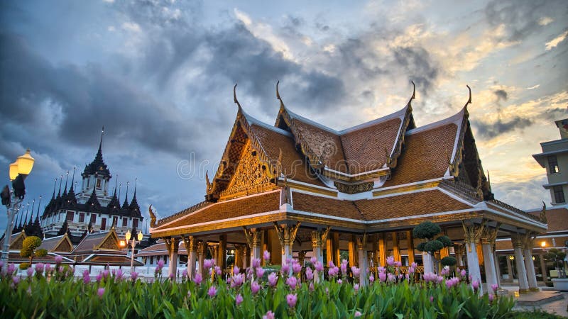 Loha Prasat and Wat Ratchanadda Temples at Sunset Stock Photo - Image ...