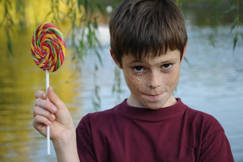 Boy Has a Big Colorful Lollipop Stock Image - Image of lollies ...
