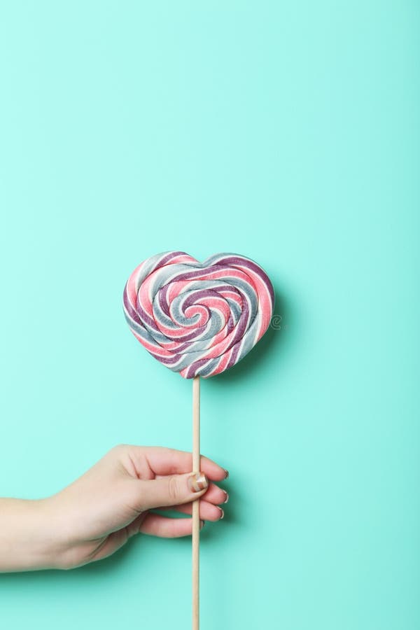 Hand Holding Lollipop Stock Photos - Download 3,630 Royalty Free Photos