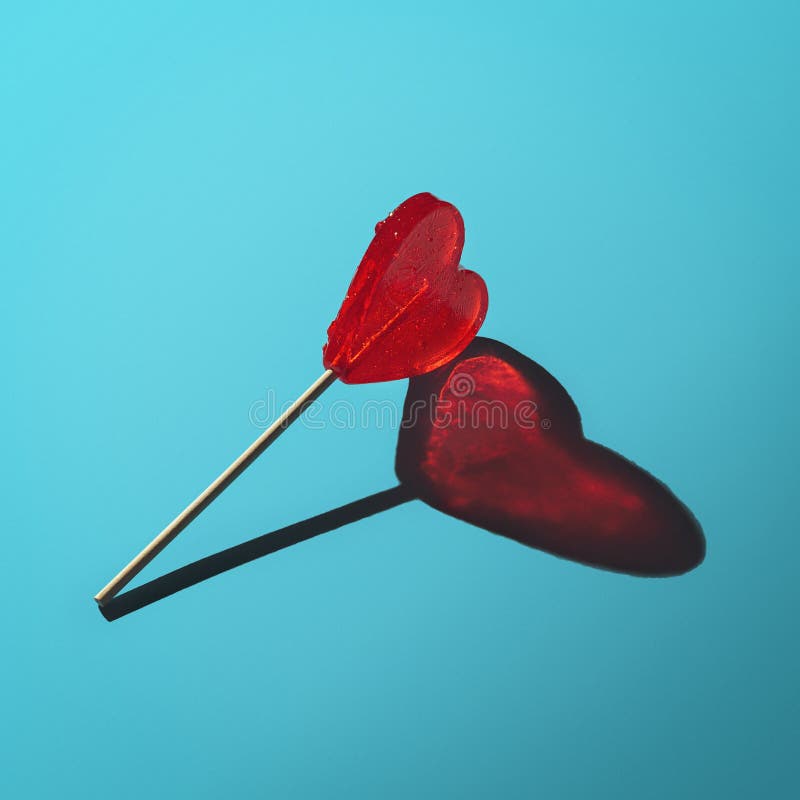 Lollipop in the Form of a Heart on a Blue Background with a Sharp ...