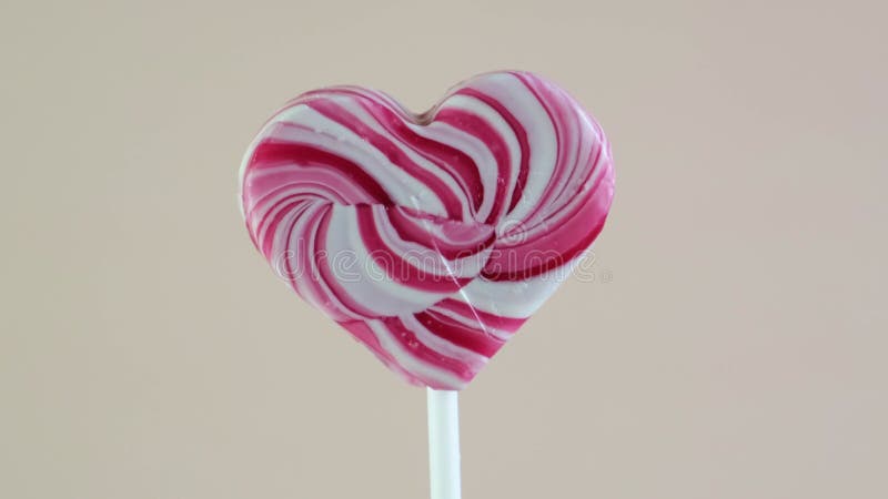 Lollipop on Plastic Stick, Rotation. Red and White Candy in the Shape ...