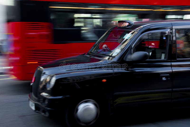 London cab and red bus editorial stock photo. Image of taxi - 45062933