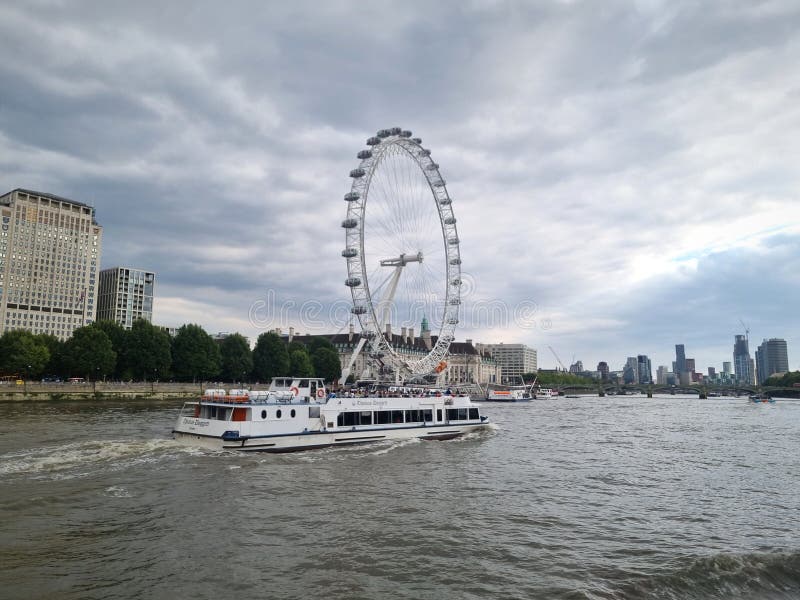 London Eye and Boat on the River Editorial Photography - Image of ...