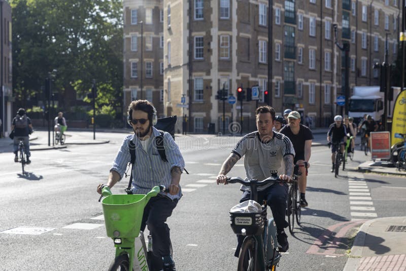 Cyclists Waiting at a Traffic Light in a London Intersection Editorial ...