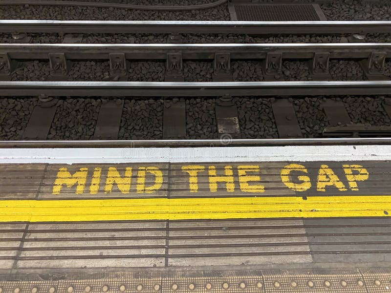 Mind the Gap Painted in Yellow on a London Underground Platform. London ...