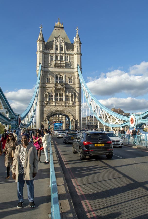 People Walking on Tower Bridge in London. the Tower Bridge Was Built ...