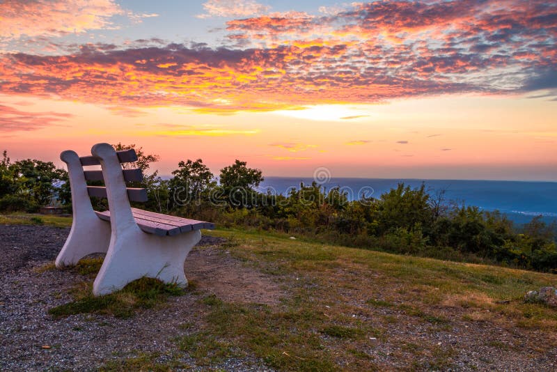 A Lone Bench Looks Over the Mountain at Sunset Stock Image - Image of ...