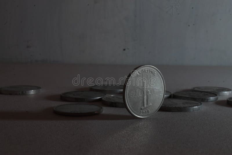 Coins in shadow stock photo. Image of furniture, light - 202873838