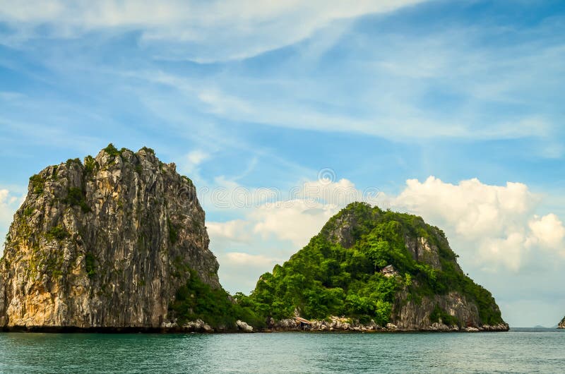 Lone island in ocean stock image. Image of cloud, landscape - 67887919