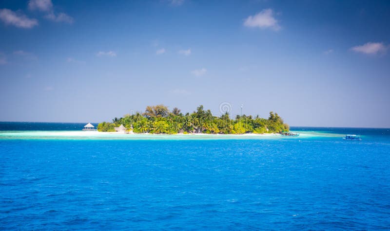 A lone island in the sea stock image. Image of maidives - 62090273