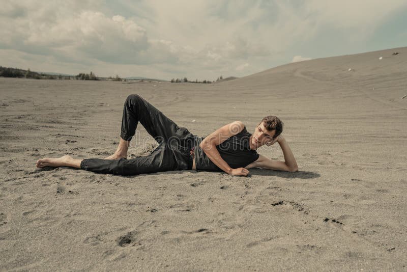 Lone Man Lying on Sand in Desert Stock Image - Image of desert, rest ...