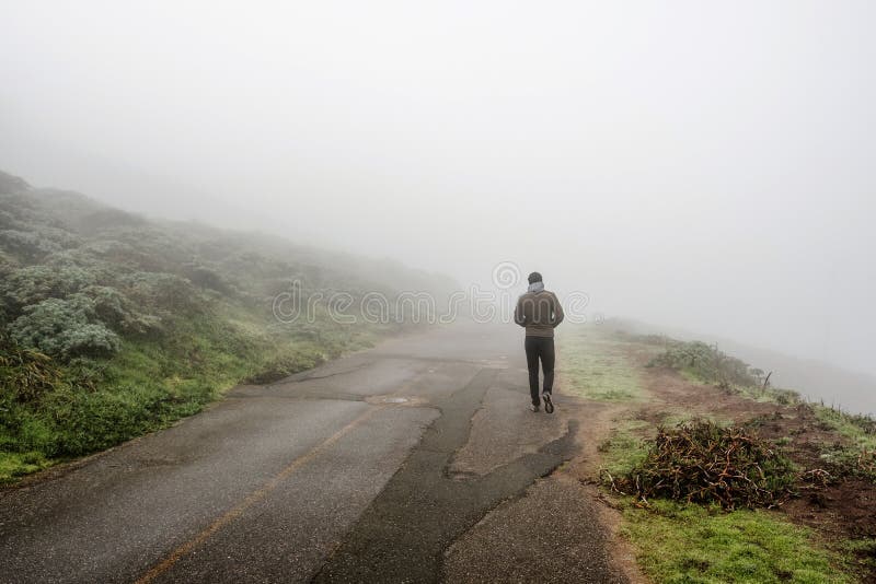 Lone Man Walking Through The White Fog Stock Image - Image of lone ...