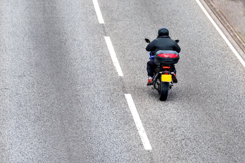 Lone Motorcycle Rider stock photo. Image of transport - 13394332