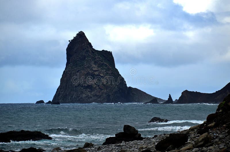 Lone rock stock photo. Image of sand, water, waves, stones - 94654958