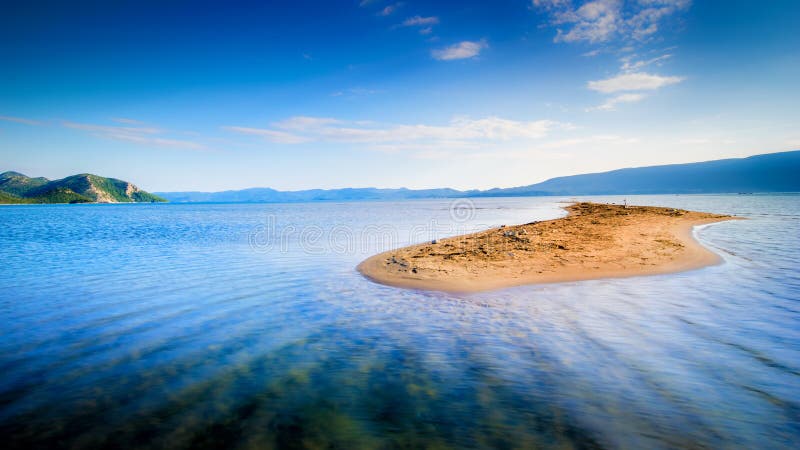 Lone Small Sandy Island in the Middle of Blue Sea Stock Photo - Image ...