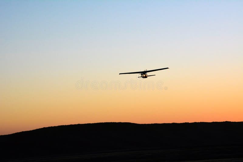 A Lone Small Single-engine Plane Flies in the Clear Evening Sky. only ...