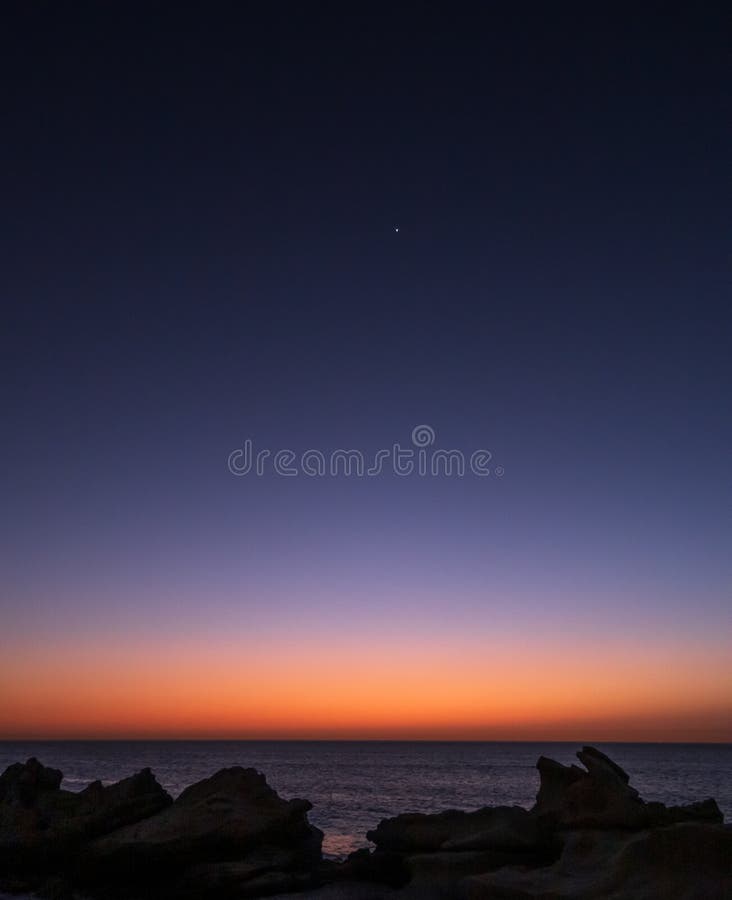 Lone Star in Dark Blue Sky Over Sunset on Atlantic Ocean Stock Photo ...