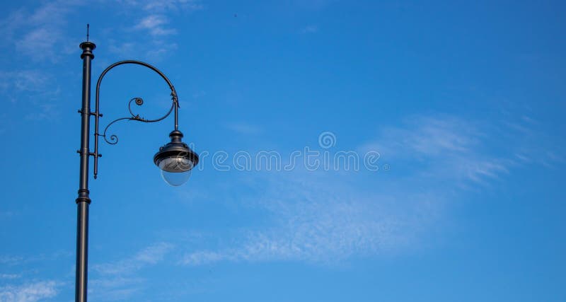 A Lone Street Lamp Post is Isolated in the Blue Sky. Summer Concept ...