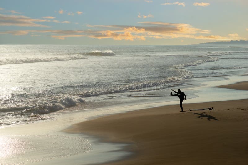 Lone Surfer Exercising on Empty Beach Stock Photo - Image of vacation ...