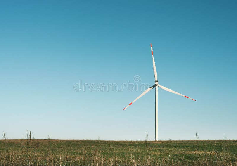 Lone Wind Turbine in Windless Field Stock Image - Image of electric ...