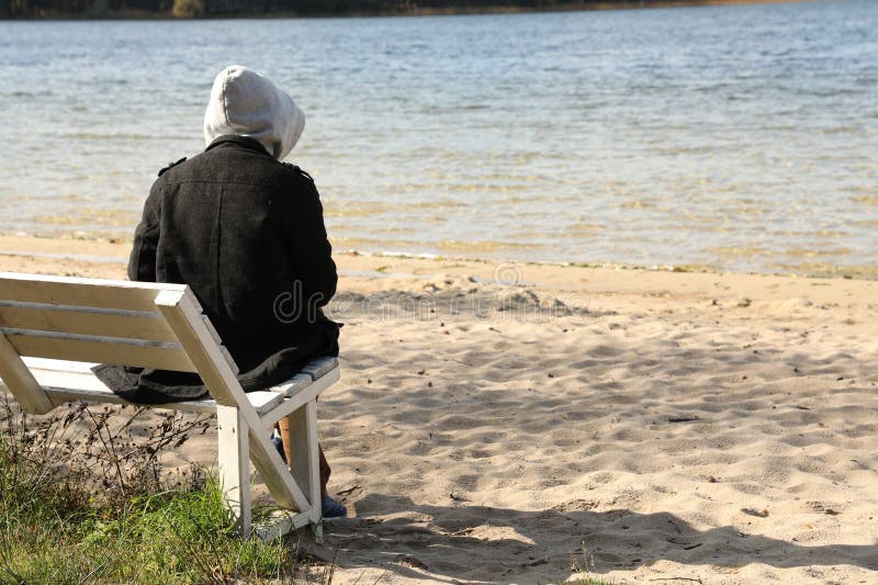 Loneliness Concept. Sad Man Sitting on Bench at Beach Stock Photo ...