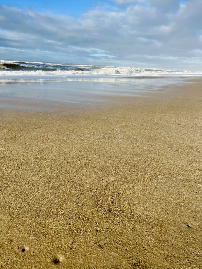 Lonely Beach with Focus on Pristine Sand and the Waves Stock Image ...