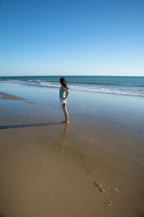 Lonely beach woman stock image. Image of ocean, skirt - 6588339