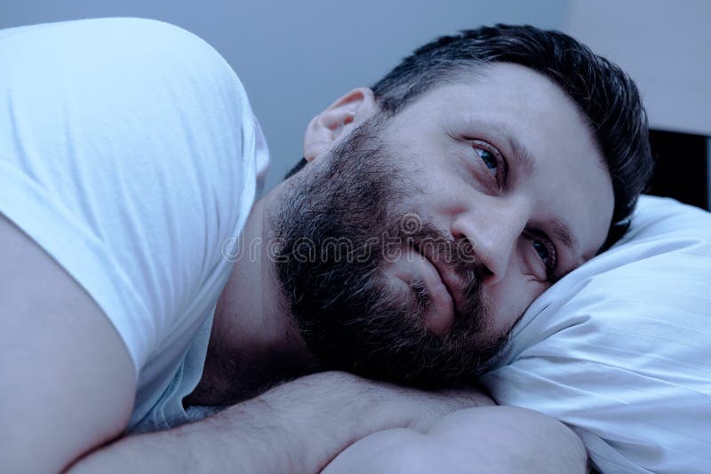 A Lonely Bearded Man Cannot Fall Asleep at Night in Bed with His Arms ...