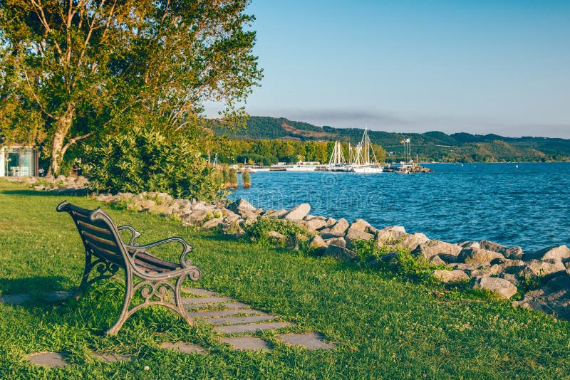 Lonely bench on sea coast stock image. Image of park - 109412671