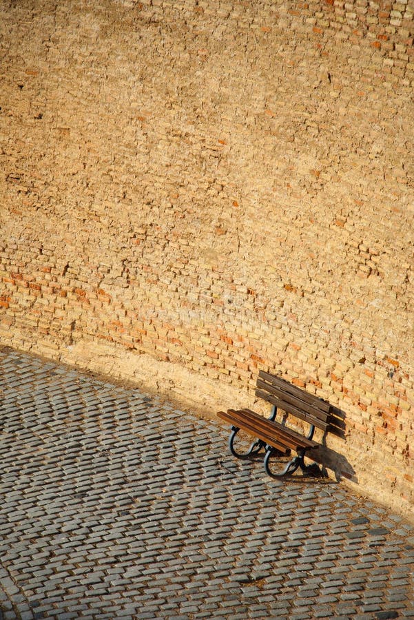 Lonely bench in the street stock image. Image of single - 29443815