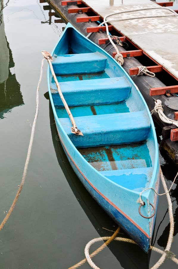 Lonely blue rowboat stock photo. Image of single, rowboat - 16442202