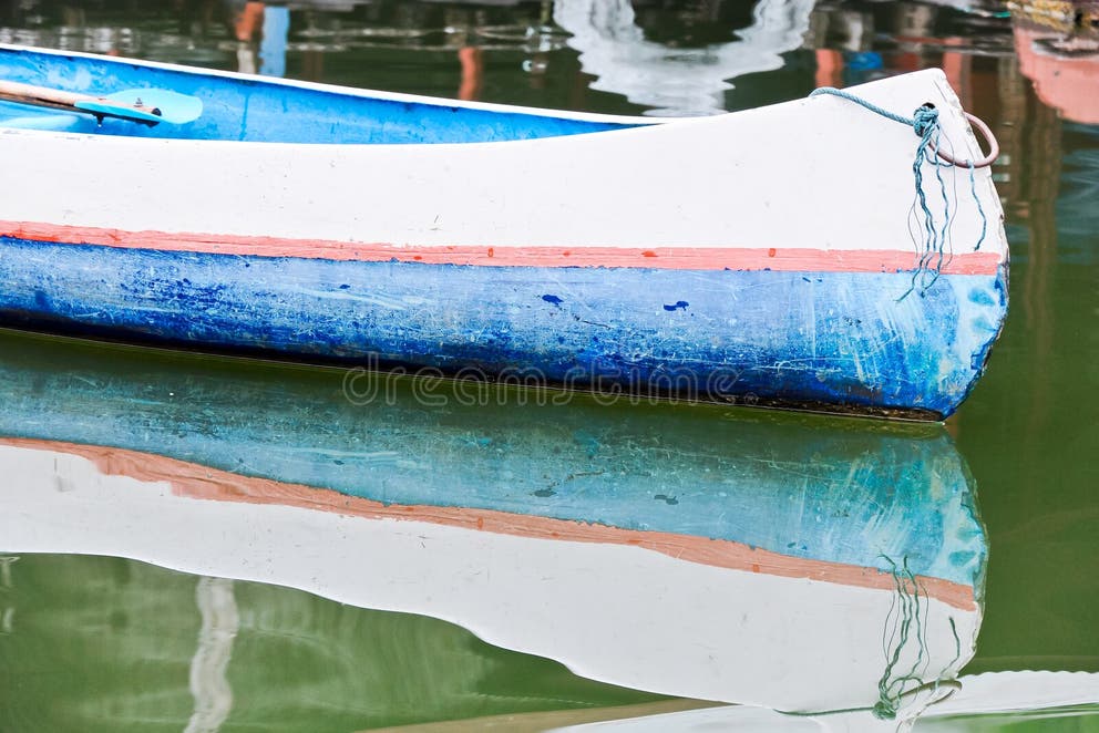 Lonely blue rowboat stock image. Image of float, lake - 22952063