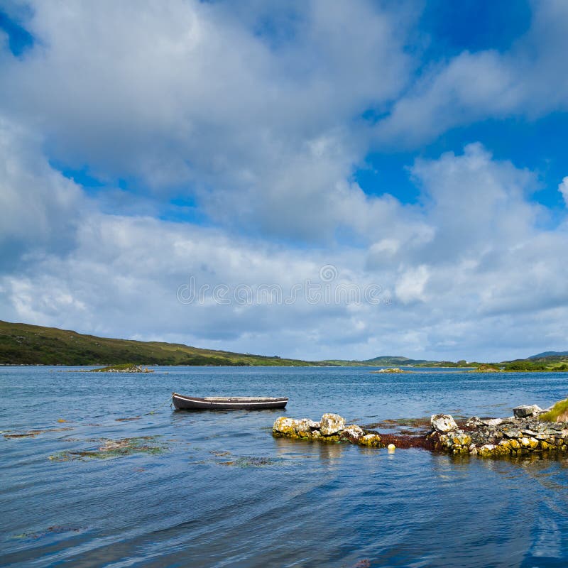 Lonely boat in Ardmore bay stock photo. Image of colour - 20867430