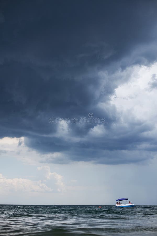 Lonely Boat in the Open Sea, Bad Weather, a Sense of Danger Stock Photo ...