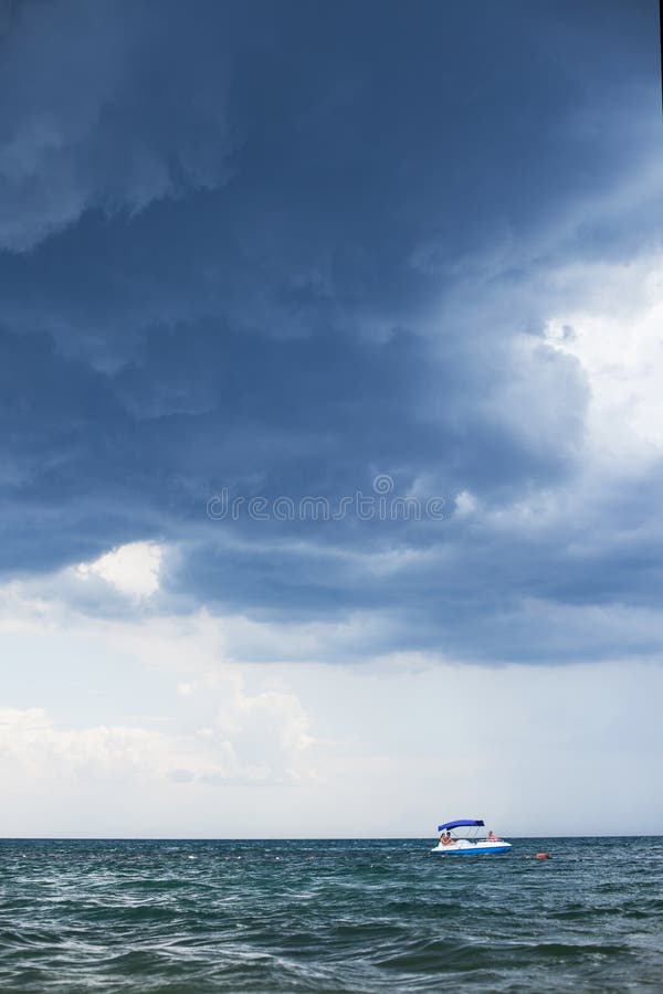 Lonely Boat in the Open Sea, Bad Weather, a Sense of Danger Stock Image ...