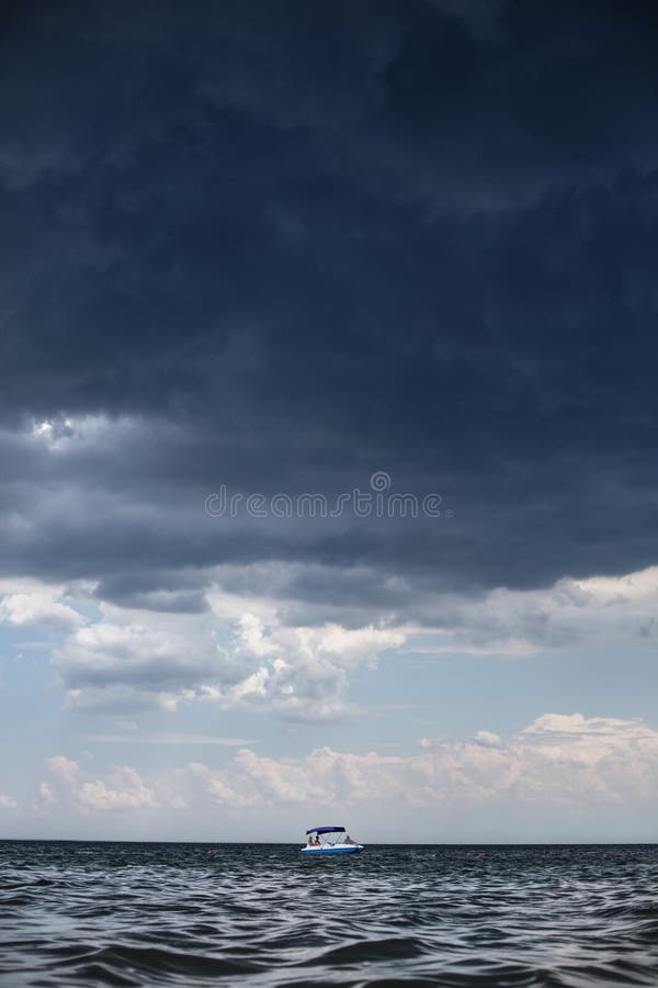 Lonely Boat in the Open Sea, Bad Weather, a Sense of Danger Stock Image ...