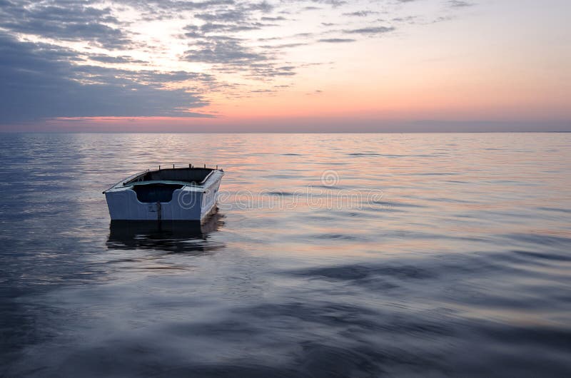 Lonely Boat on the Sea at Sunset. Stock Photo - Image of jurmala ...