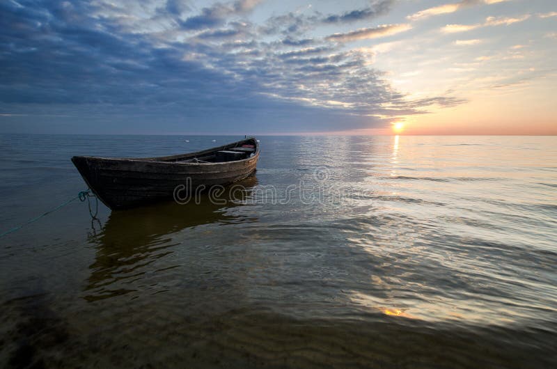 Lonely Boat on the Sea at Sunset. Stock Image - Image of lonely, marine ...