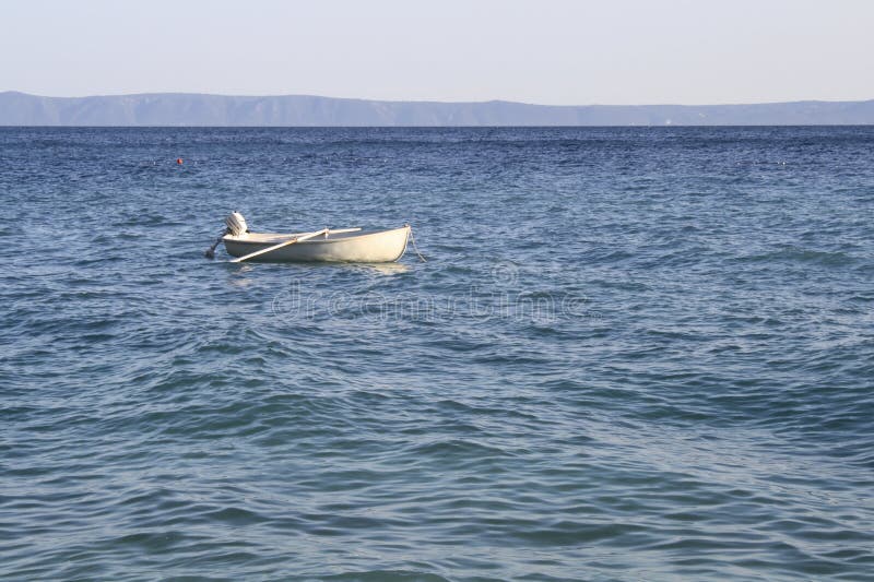 Lonely boat in the sea stock photo. Image of ship, waves - 53223266