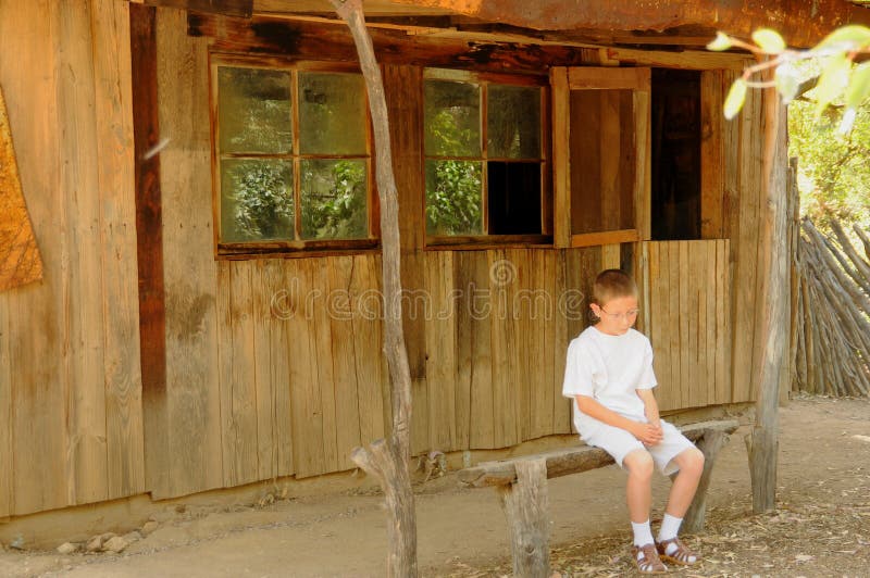 Lonely Boy at Old Cabin stock photo. Image of alone, worry - 9222212
